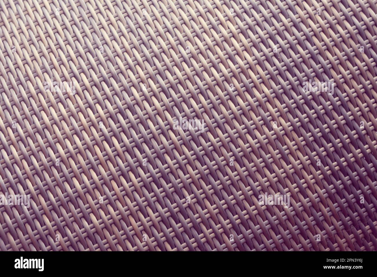 Synthetic rattan texture weaving background as used on outdoor garden ...