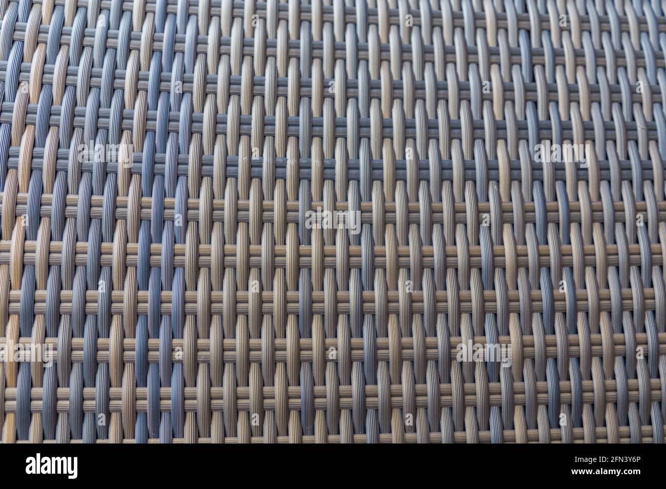 Synthetic rattan texture weaving background as used on outdoor garden ...