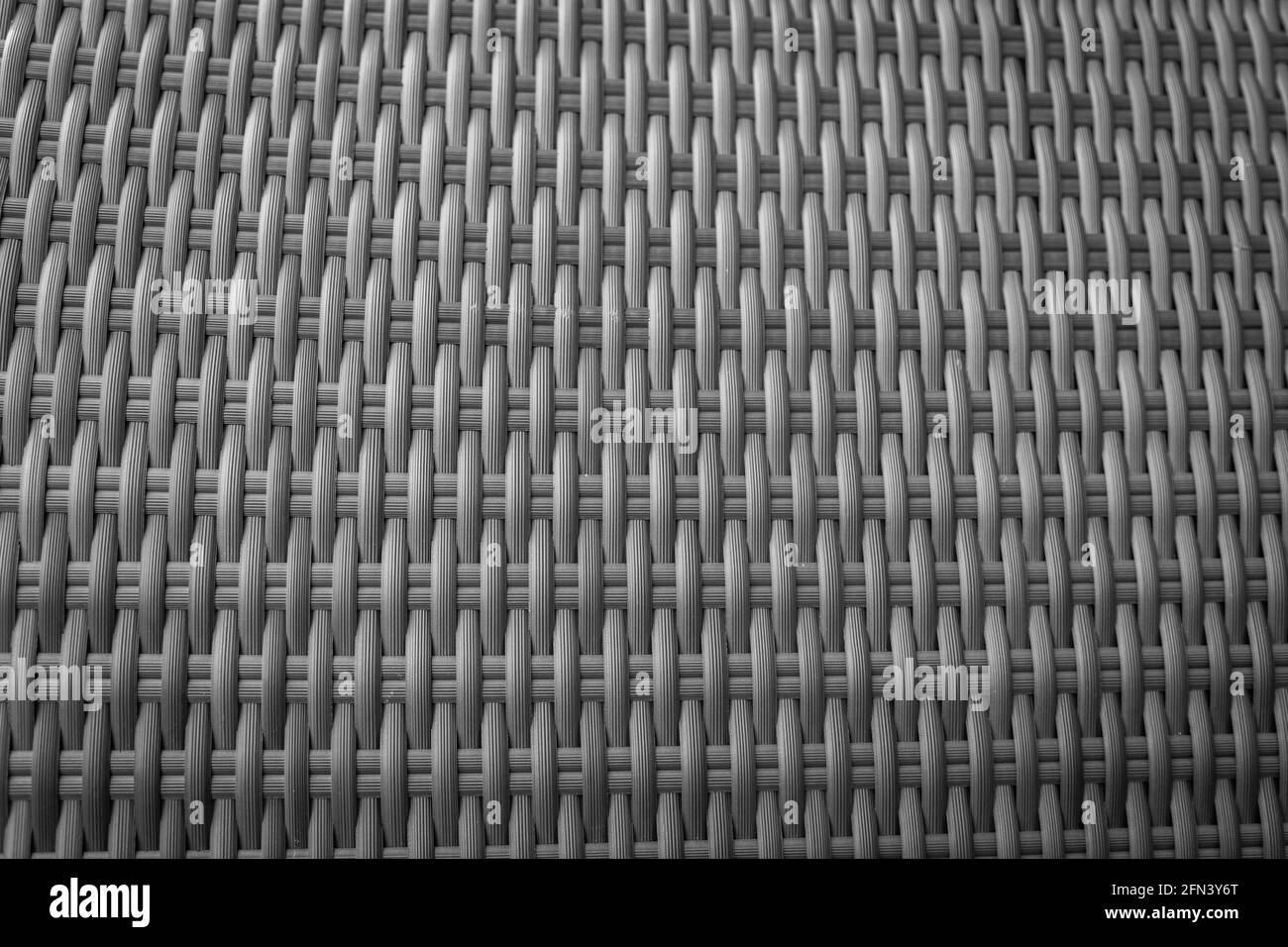 Synthetic rattan texture weaving background as used on outdoor garden ...