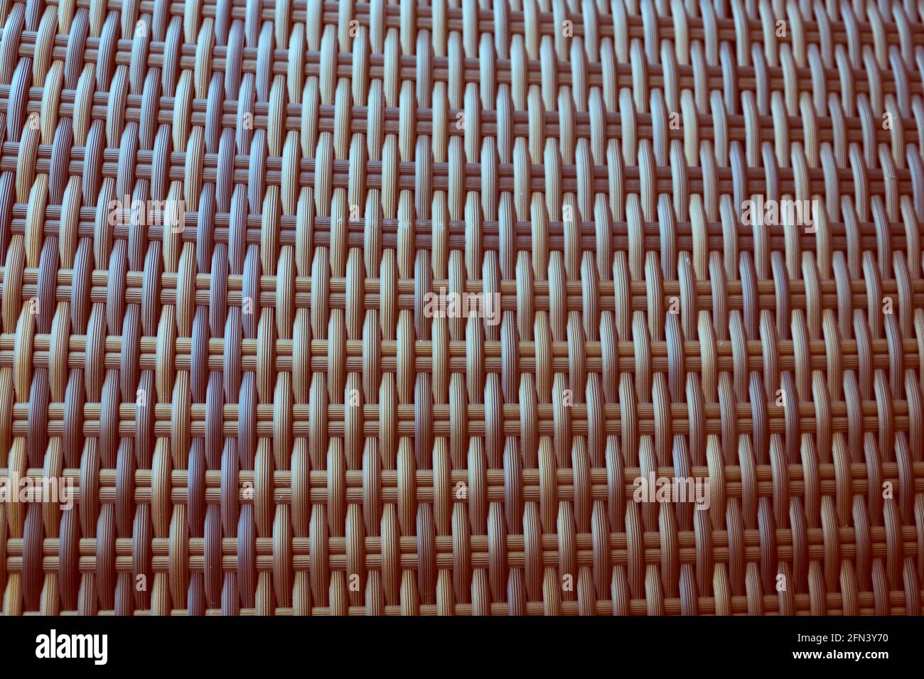 Synthetic rattan texture weaving background as used on outdoor garden ...