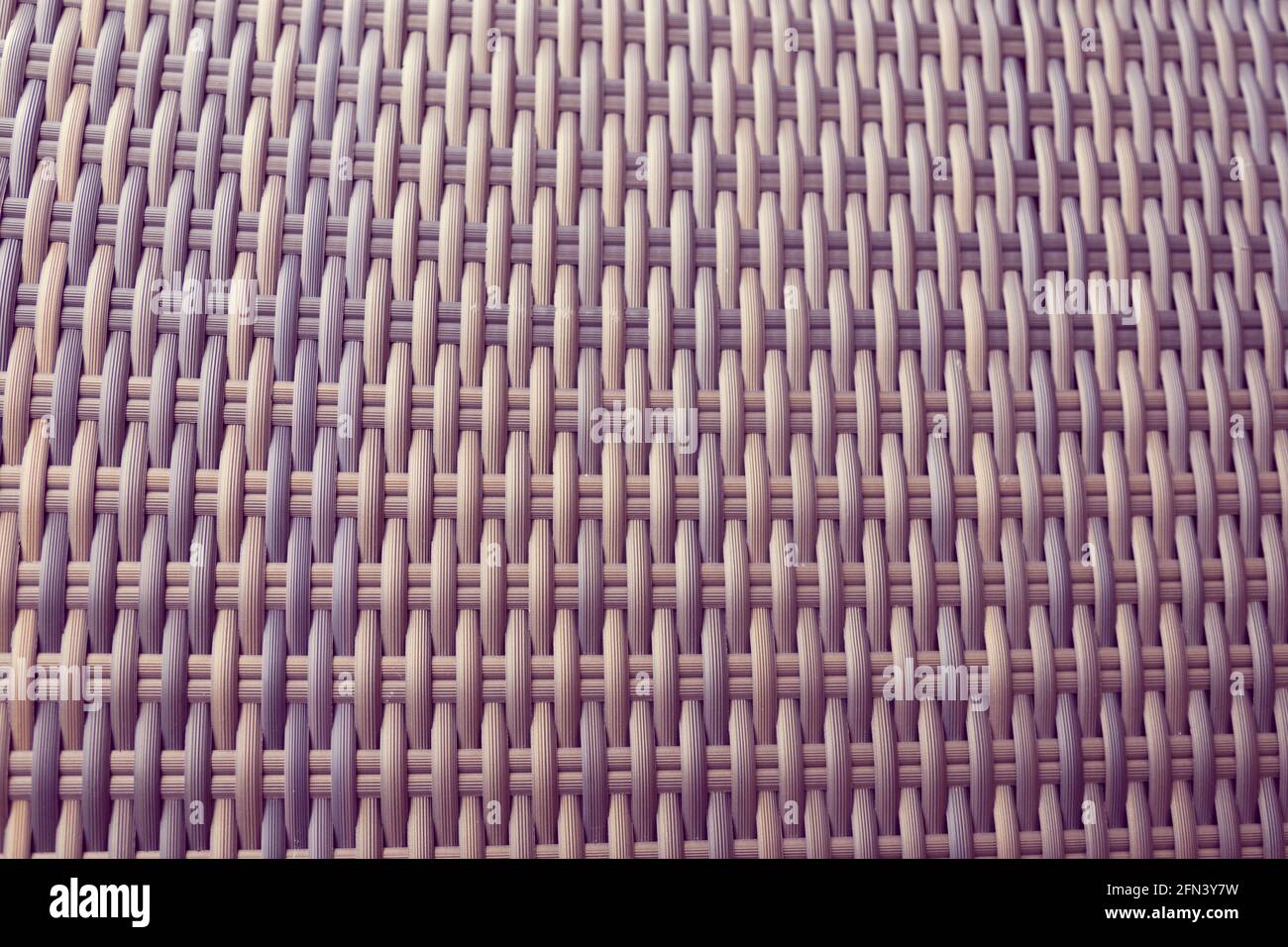 Synthetic rattan texture weaving background as used on outdoor garden ...