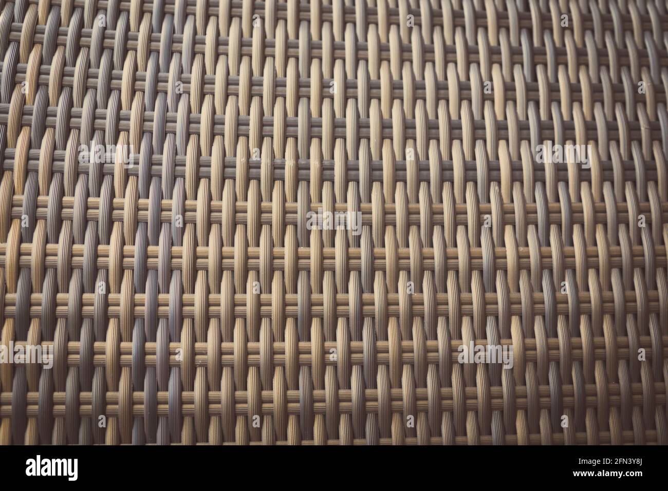 Synthetic rattan texture weaving background as used on outdoor garden ...