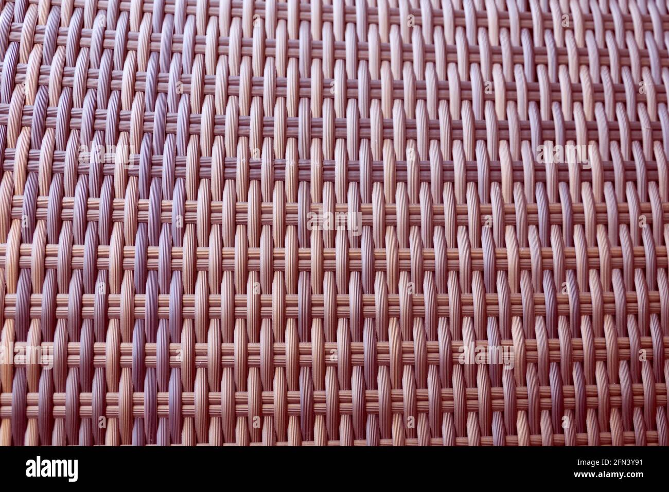 Synthetic rattan texture weaving background as used on outdoor garden ...