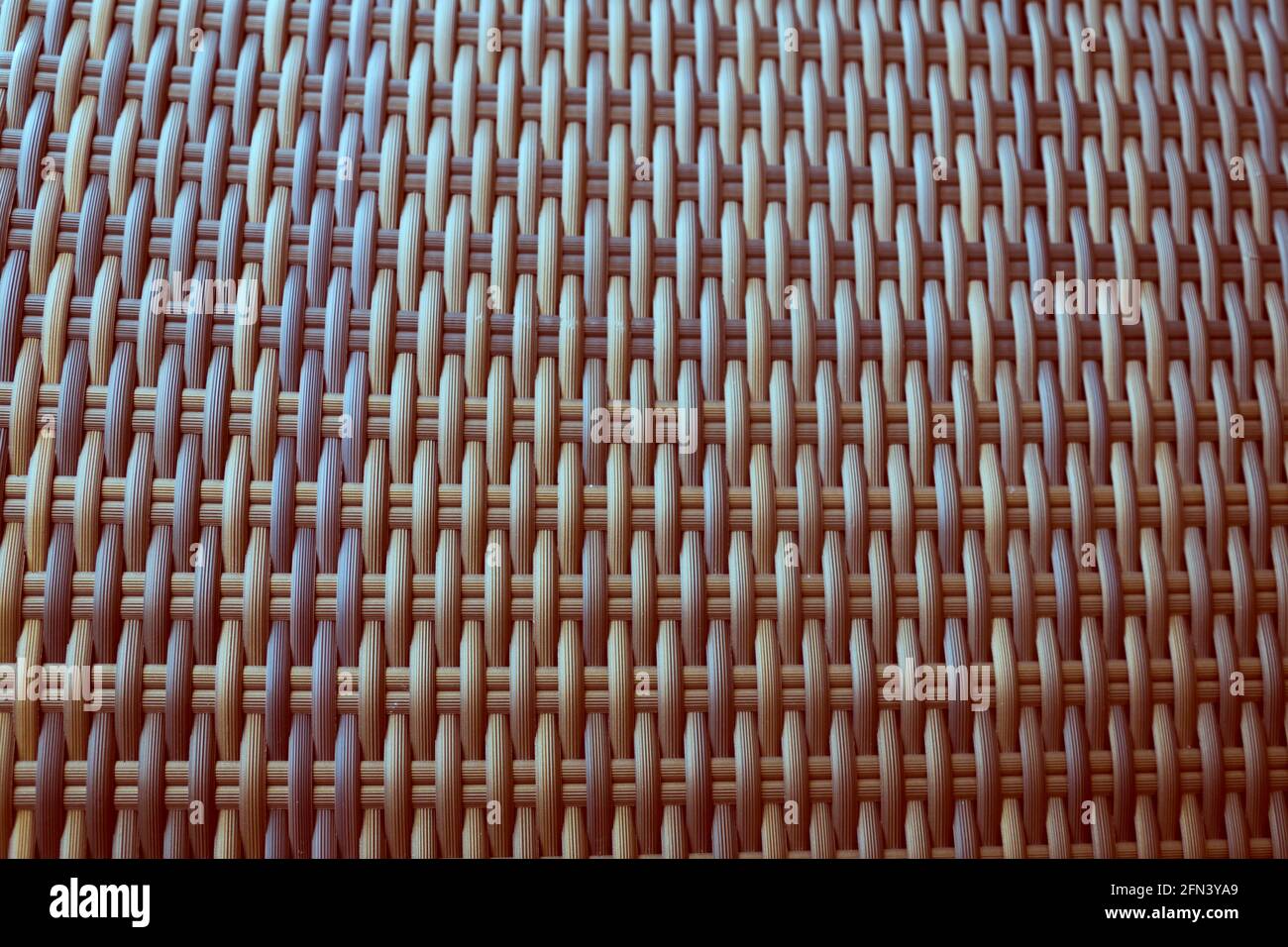Synthetic rattan texture weaving background as used on outdoor garden ...