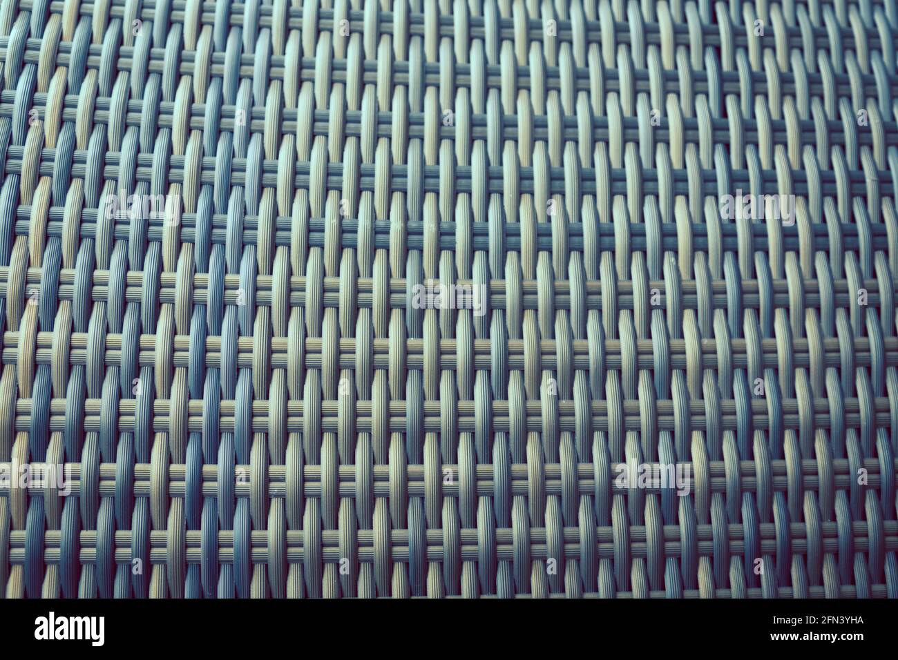 Synthetic rattan texture weaving background as used on outdoor garden ...