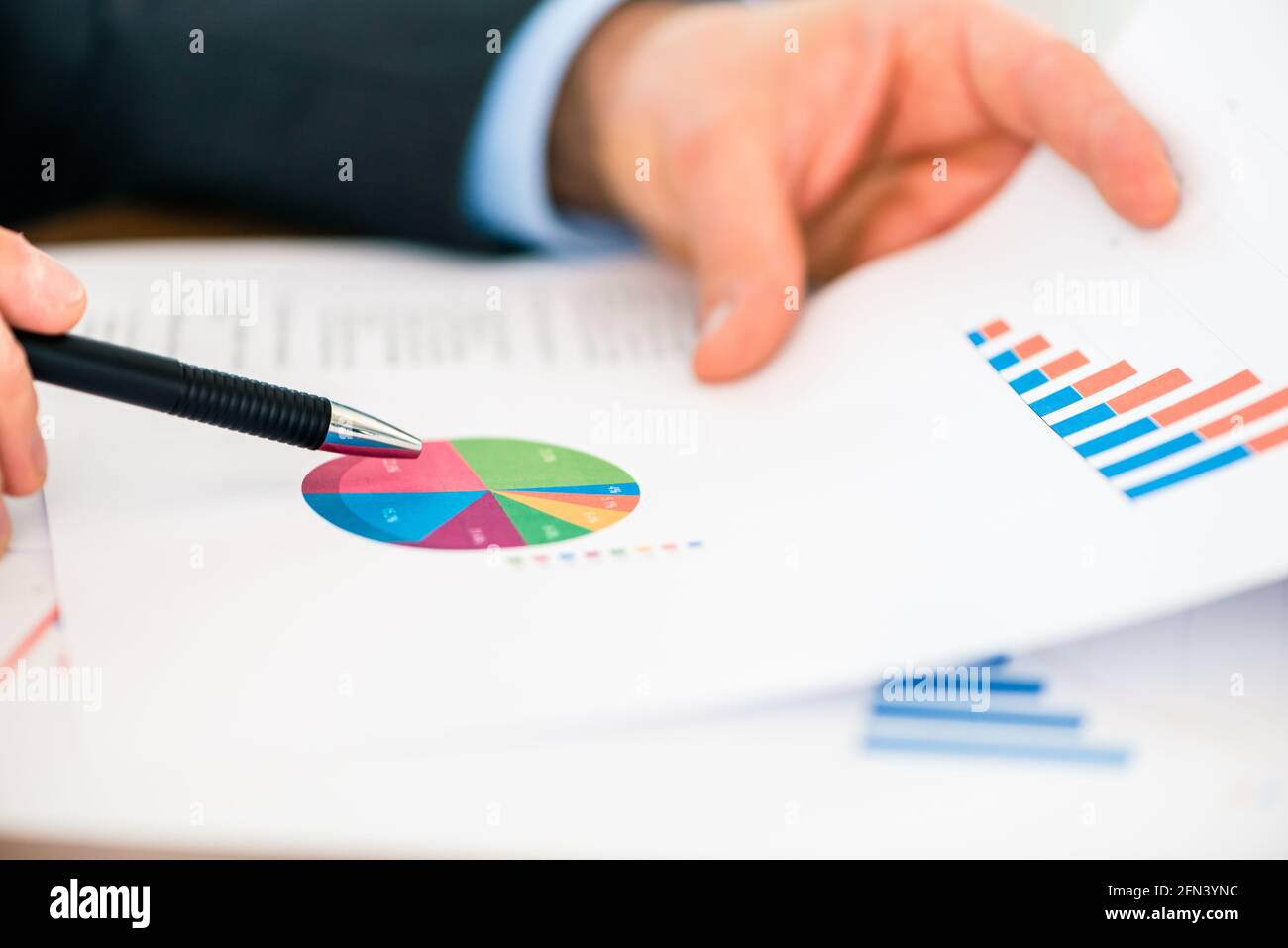 Business - banker, Manager or expert evaluates the figures on and ...