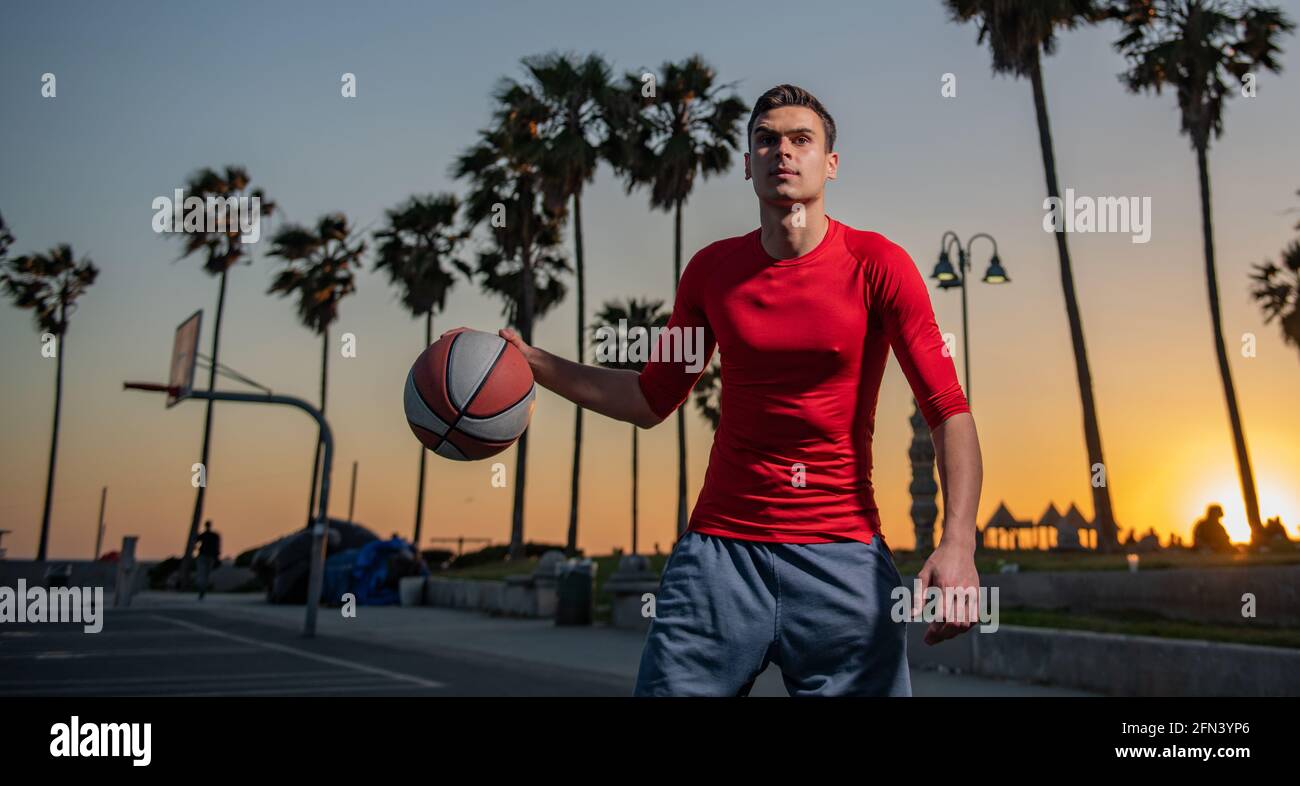 Basketball street player with basketball ball outdoor Stock Photo - Alamy