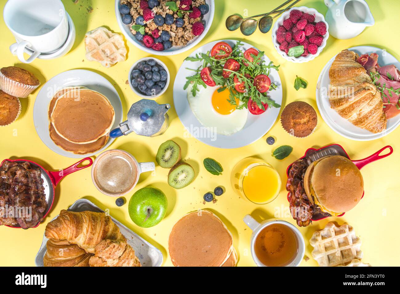 Various traditional breakfast food - fried eggs with bacon, muesli ...