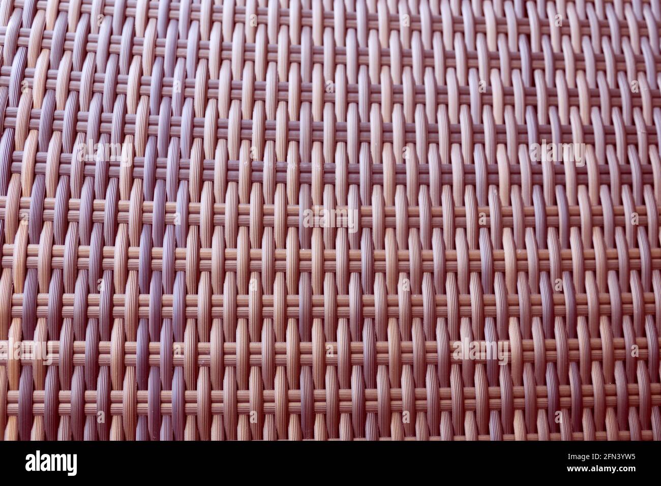 Synthetic rattan texture weaving background as used on outdoor garden ...