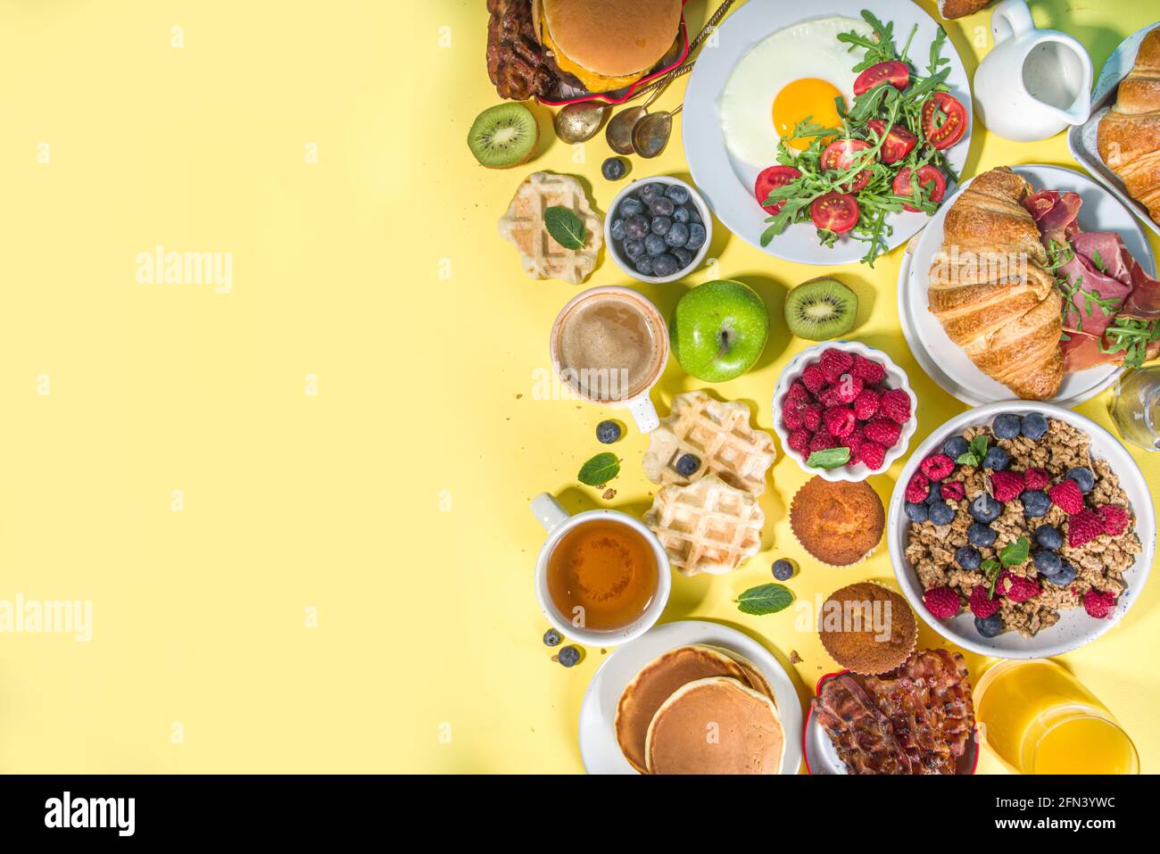 Various traditional breakfast food - fried eggs with bacon, muesli ...