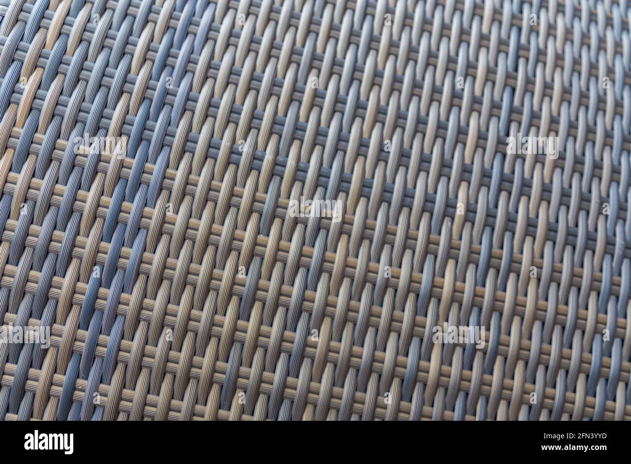 Synthetic rattan texture weaving background as used on outdoor garden ...
