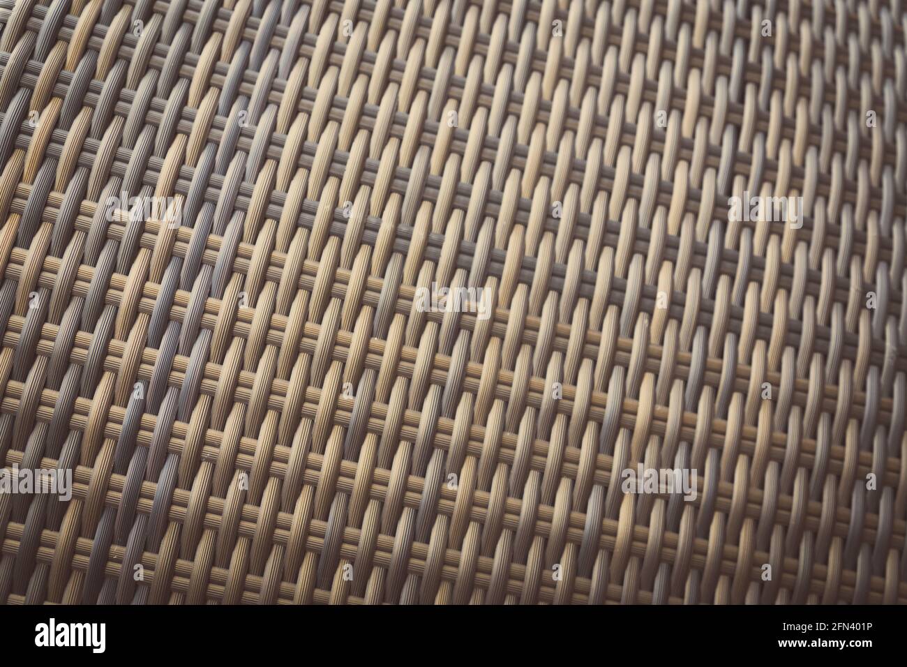 Synthetic rattan texture weaving background as used on outdoor garden ...