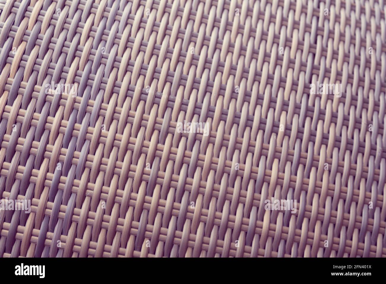 Synthetic rattan texture weaving background as used on outdoor garden ...