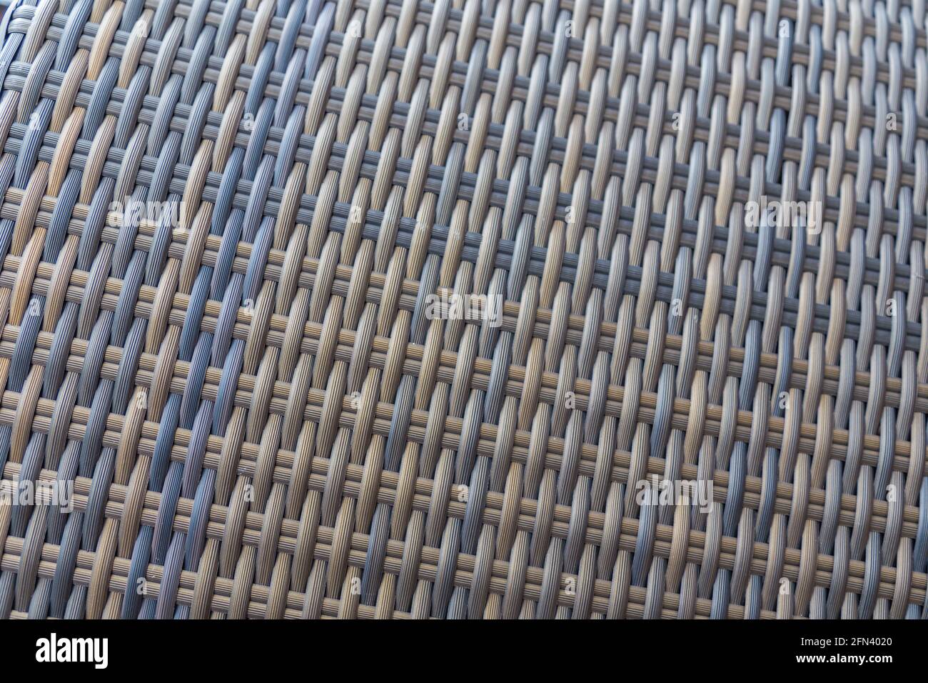 Synthetic rattan texture weaving background as used on outdoor garden ...