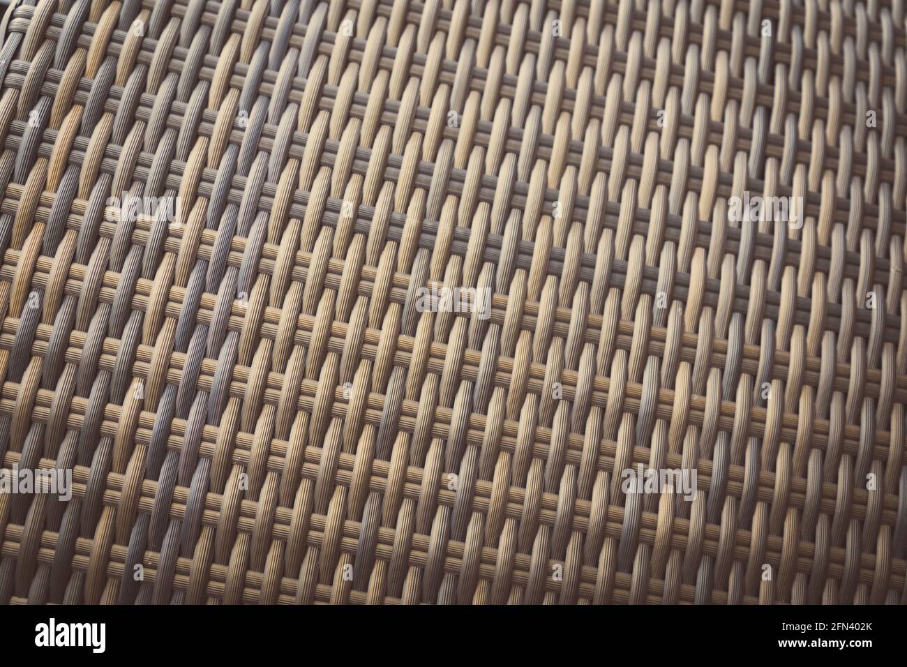 Synthetic rattan texture weaving background as used on outdoor garden ...