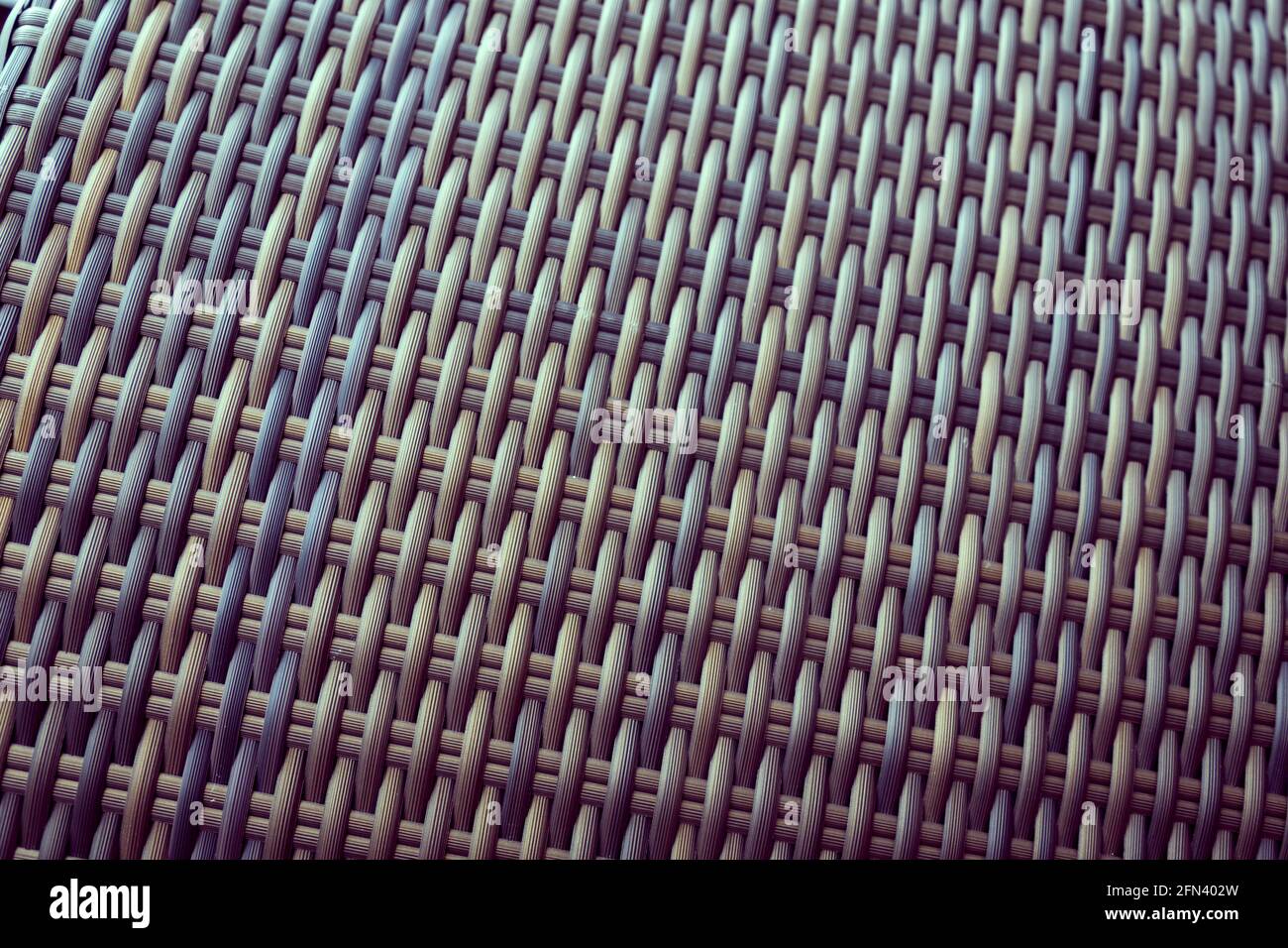 Synthetic rattan texture weaving background as used on outdoor garden ...