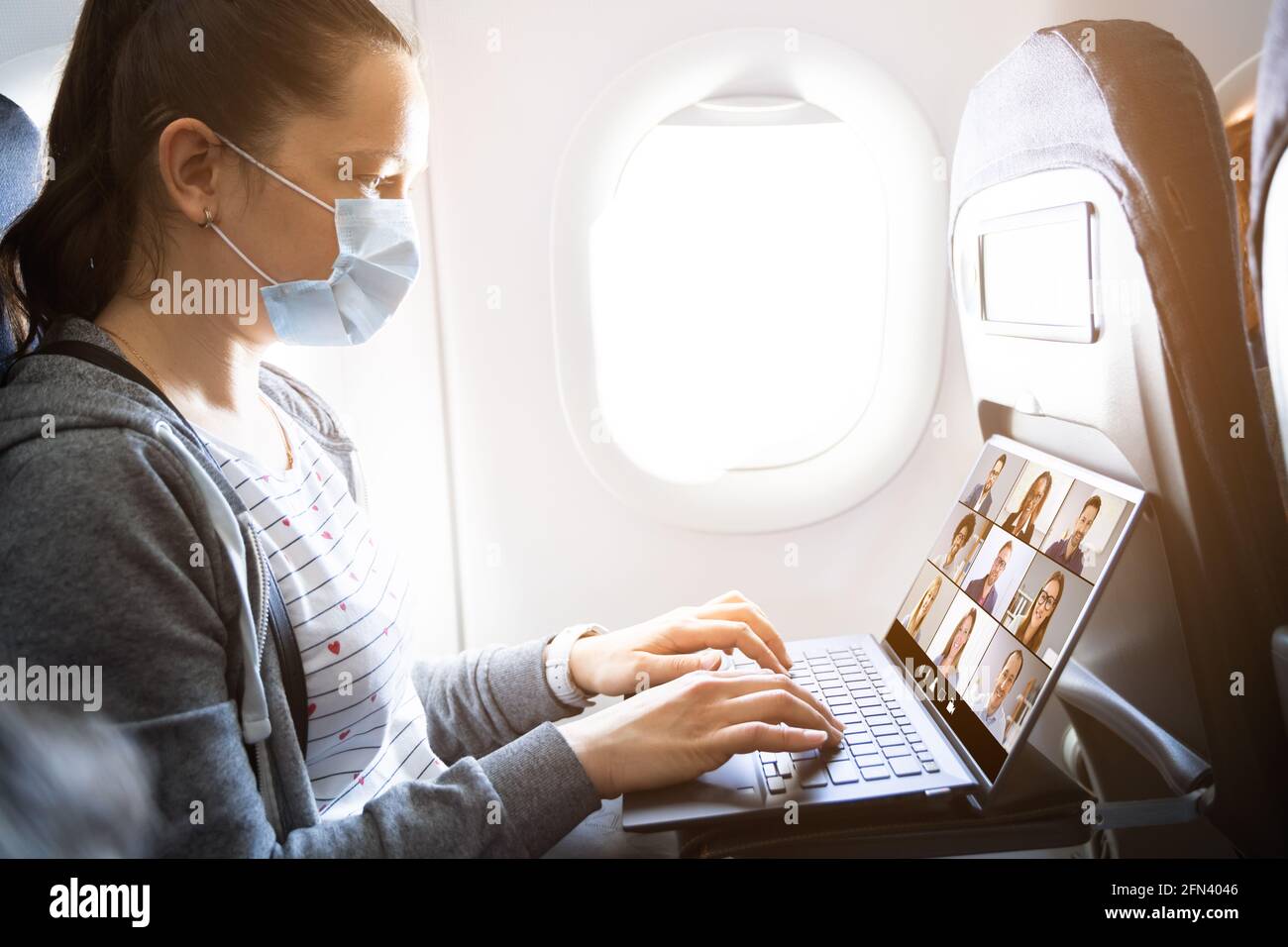 Business Flight Passenger On Airplane Using Internet Conference Stock ...