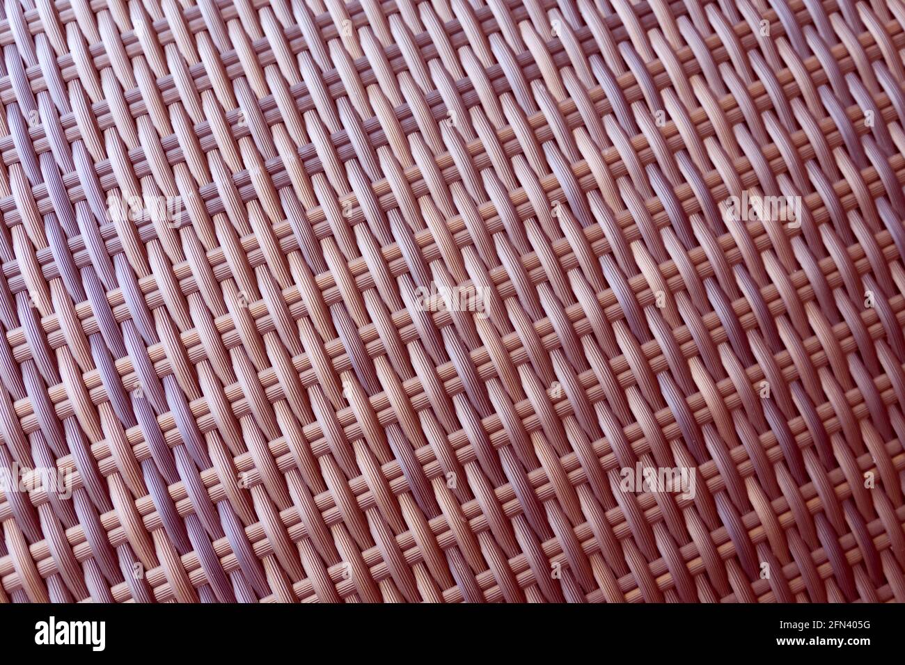 Synthetic rattan texture weaving background as used on outdoor garden ...