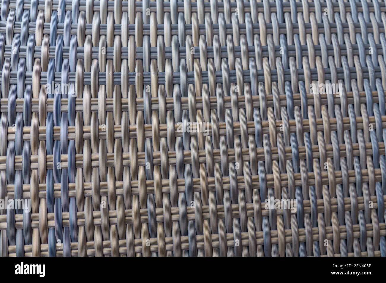 Synthetic rattan texture weaving background as used on outdoor garden ...