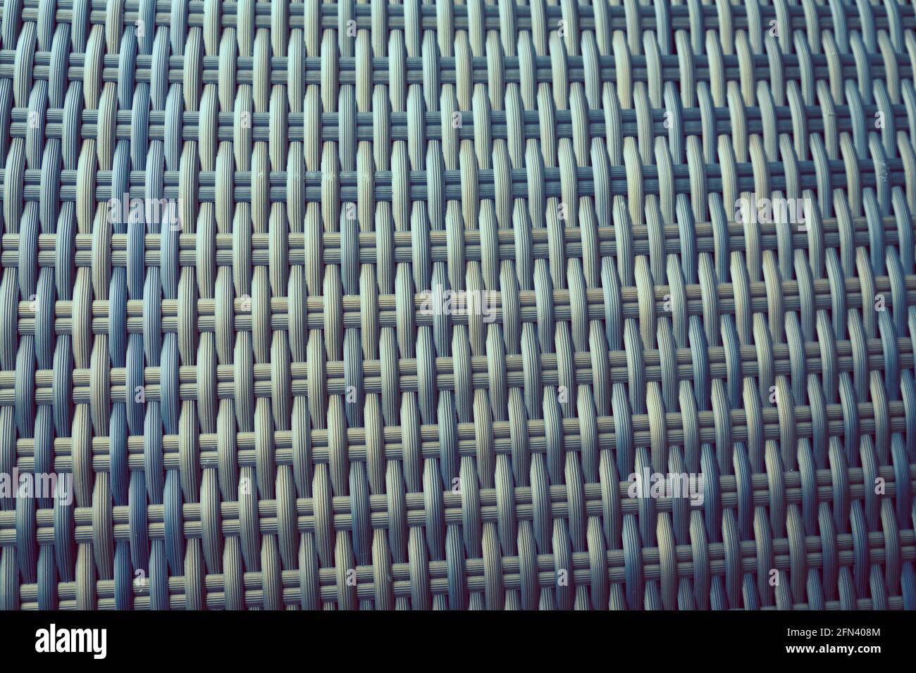 Synthetic rattan texture weaving background as used on outdoor garden ...