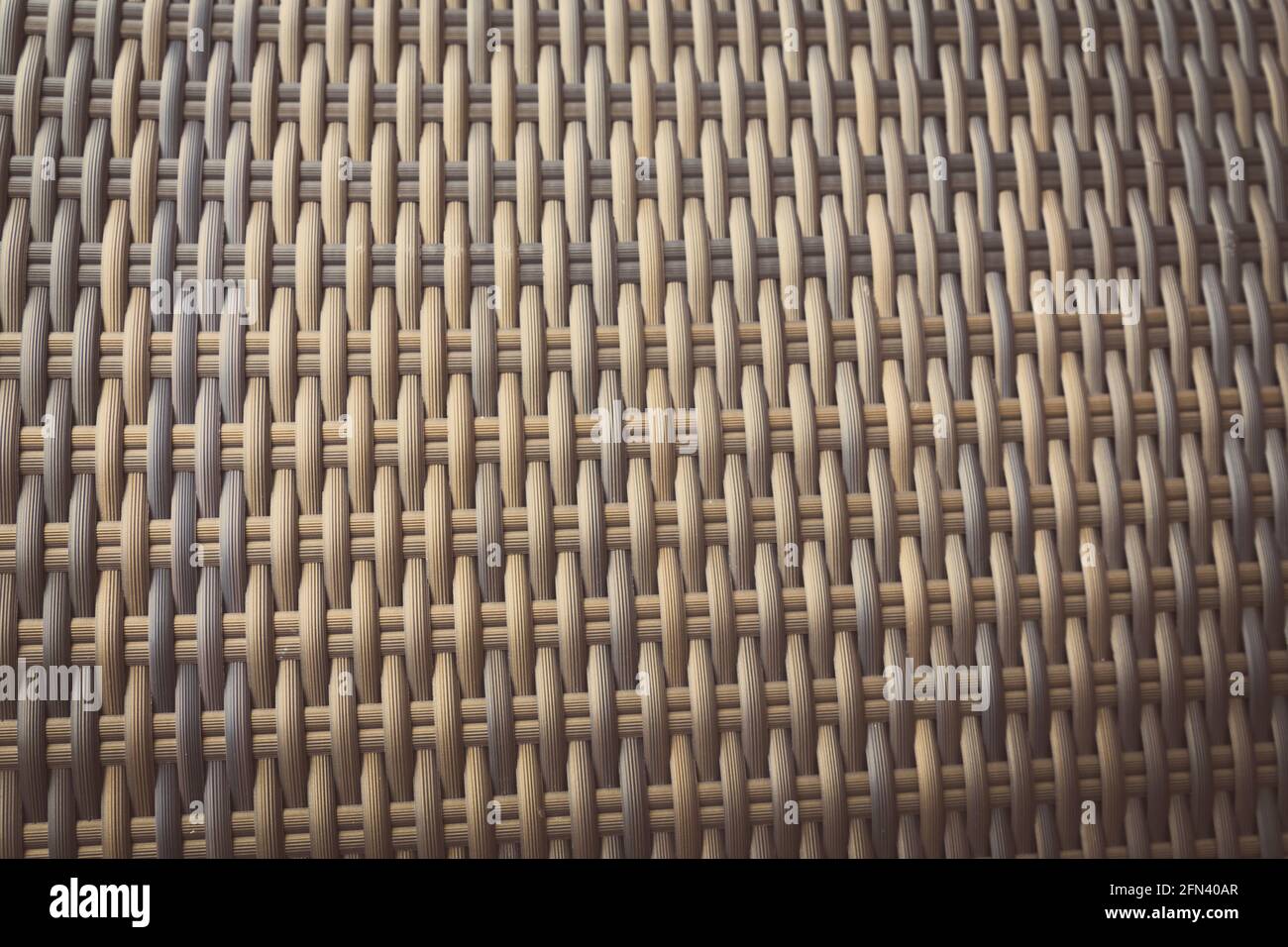 Synthetic rattan texture weaving background as used on outdoor garden ...