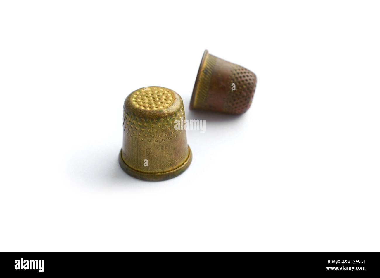 Two vintage thimbles isolated on a white background with shadow Stock ...