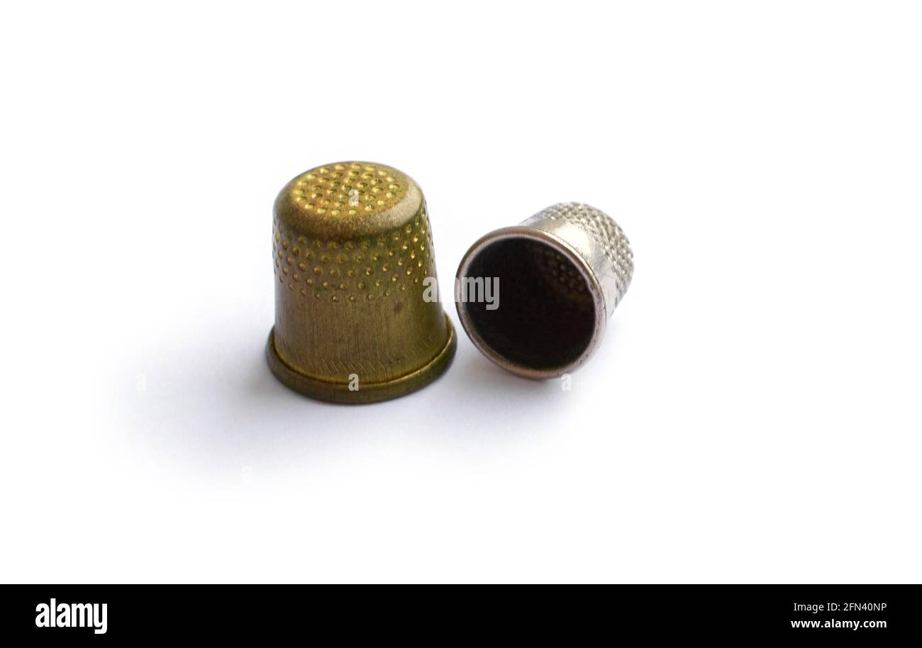 Two vintage thimbles isolated on a white background with shadow Stock ...