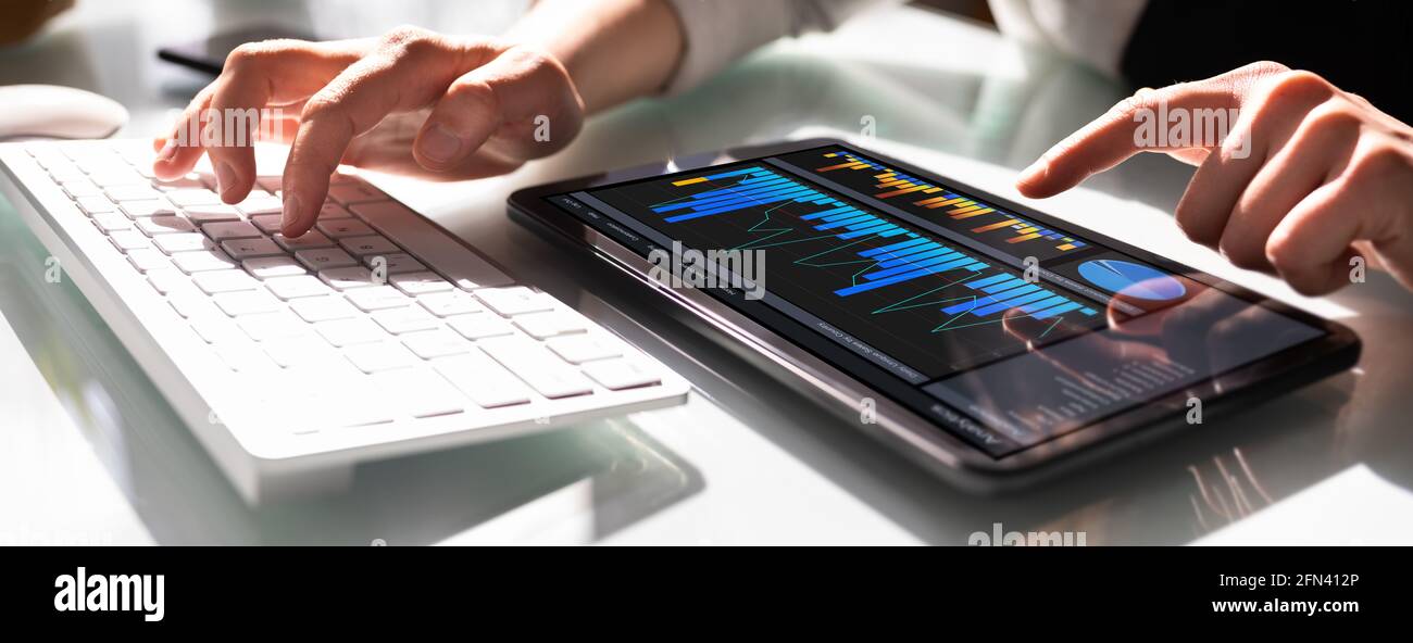 Investor KPI Analytics Graph. Hand Pointing At Data Stock Photo - Alamy