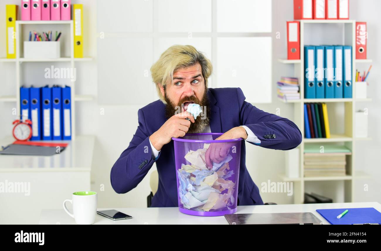 destroy evidence. disposal of paper in trash is must. man hold ...