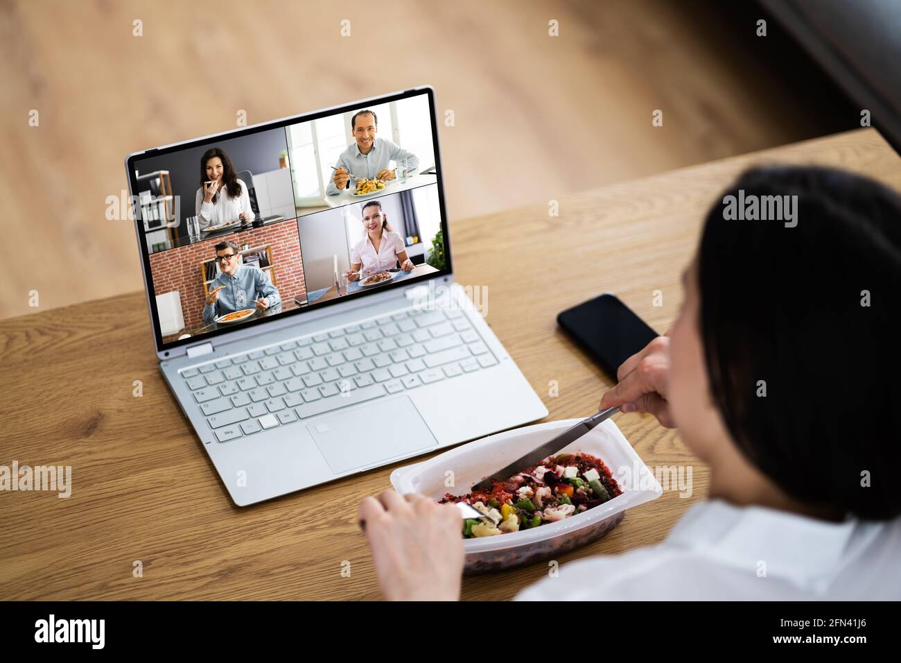 Woman Eating Virtual Video Lunch On Laptop Computer Stock Photo - Alamy