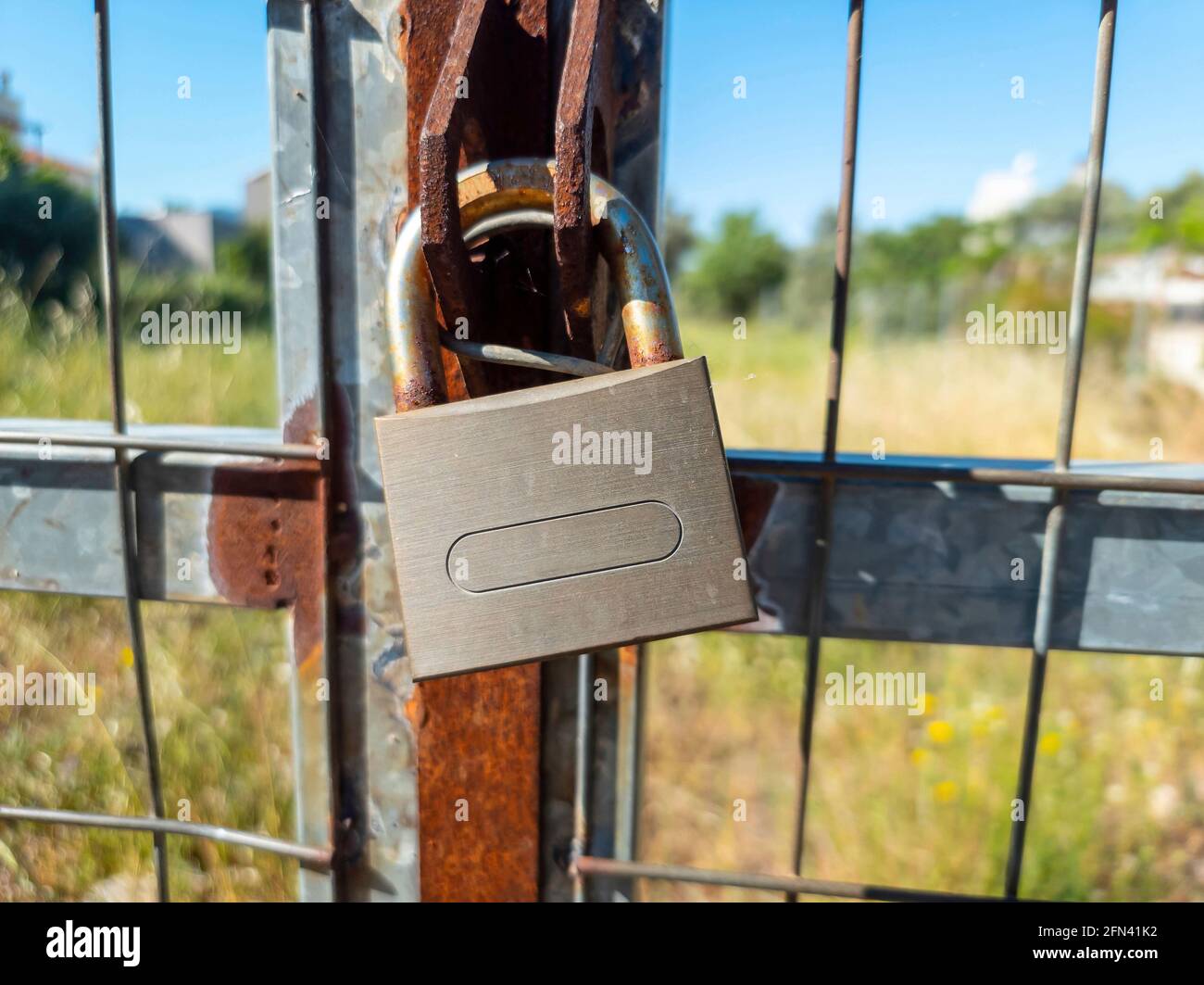 Privacy and protection of property concept. Rusty old padlock locked on ...