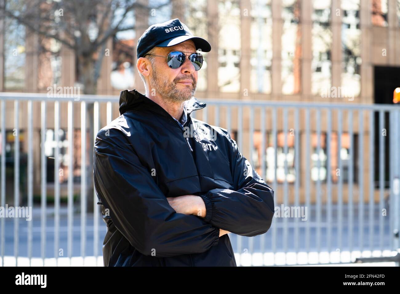 Security Guard Or Agent Standing At Entrance Stock Photo - Alamy