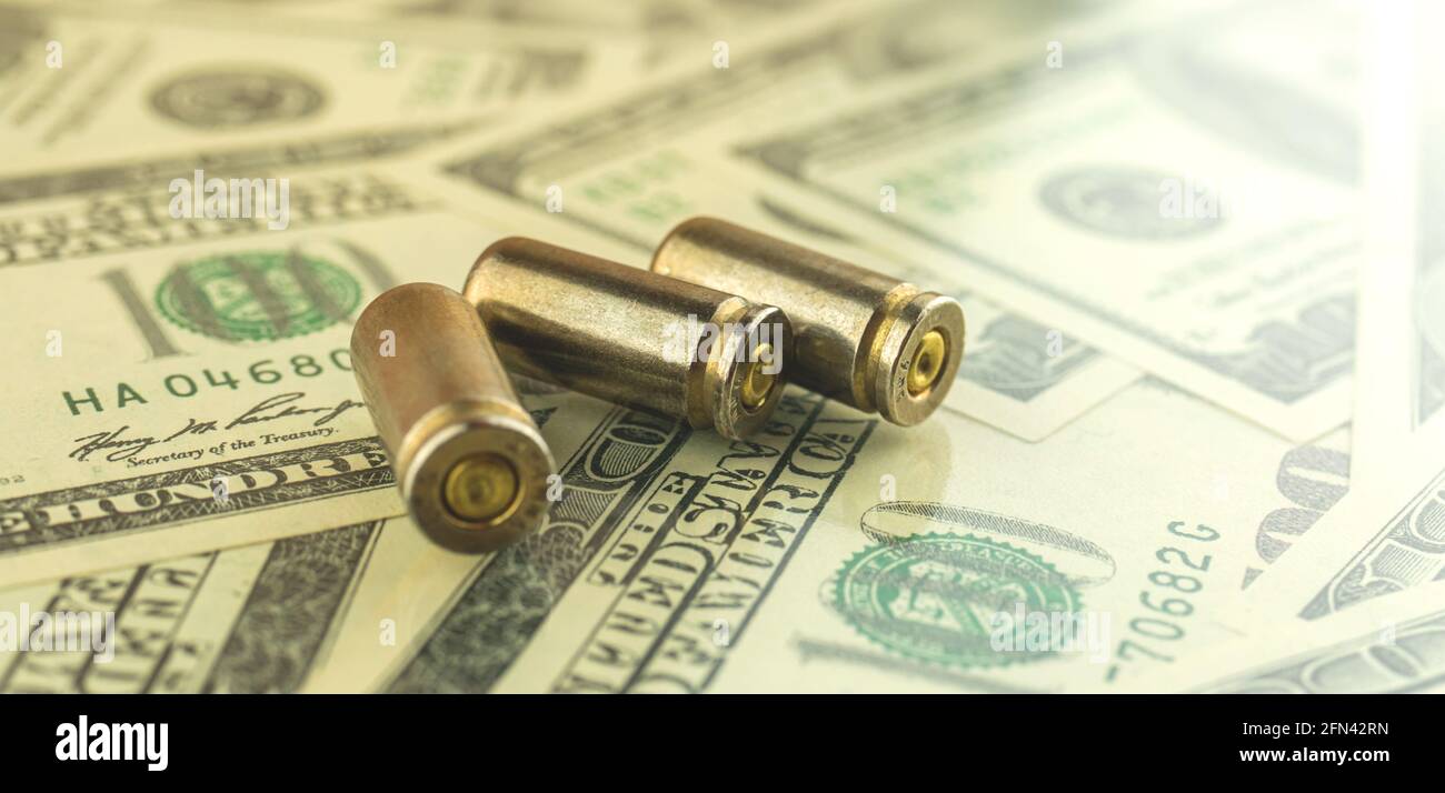 The concept of money theft and corruption, bullet for a gun, crime ...