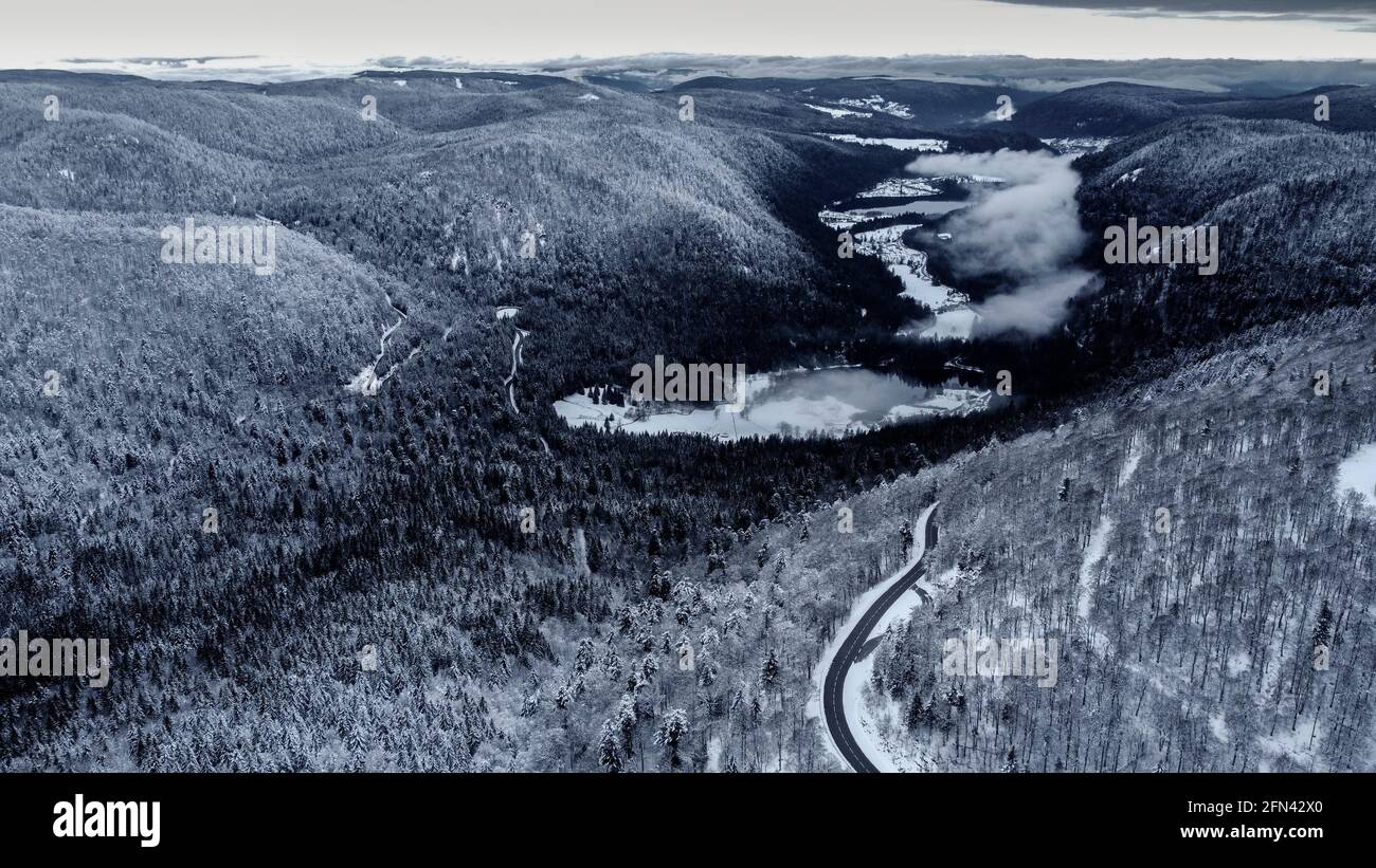 Drone view snowy valley forest hi-res stock photography and images - Alamy