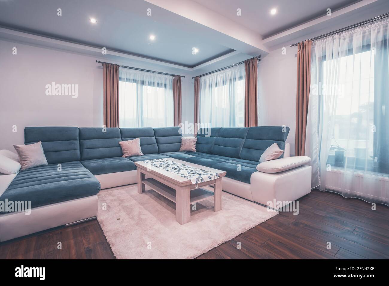 Modern living room interior - wide angle photo Stock Photo - Alamy