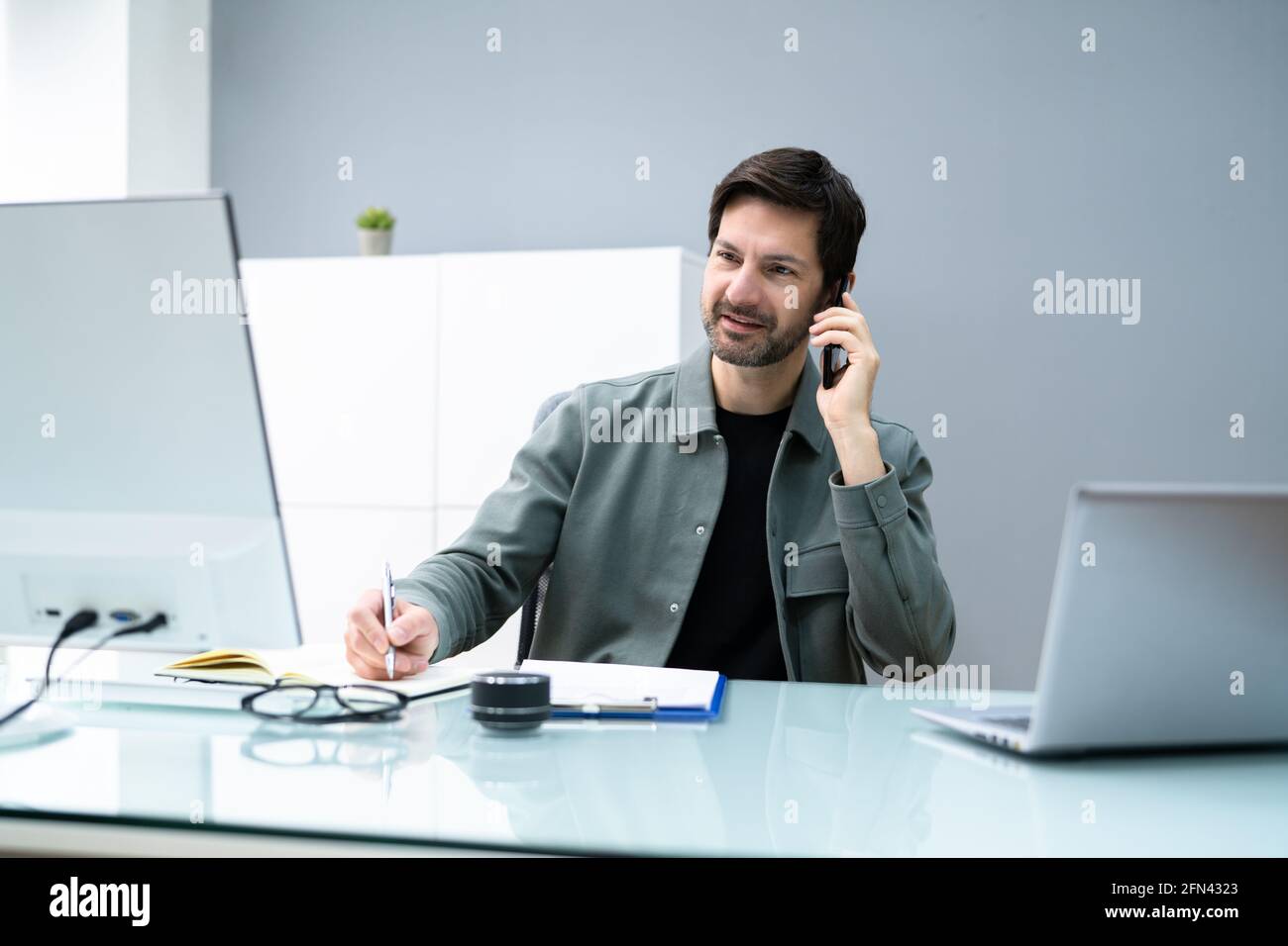 Receptionist Phone Call On Corporate Telephone At Office Stock Photo ...