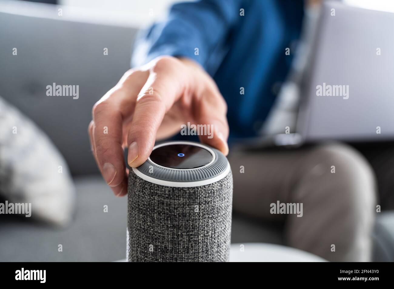 Using Smart Voice Assistant Wireless Mini Speaker Stock Photo - Alamy