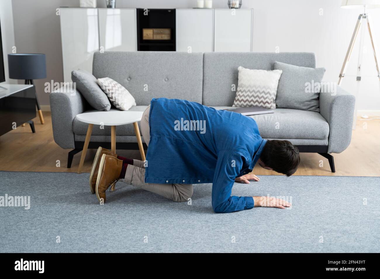 Man Looking For Lost Keys Or Searching Something Stock Photo - Alamy