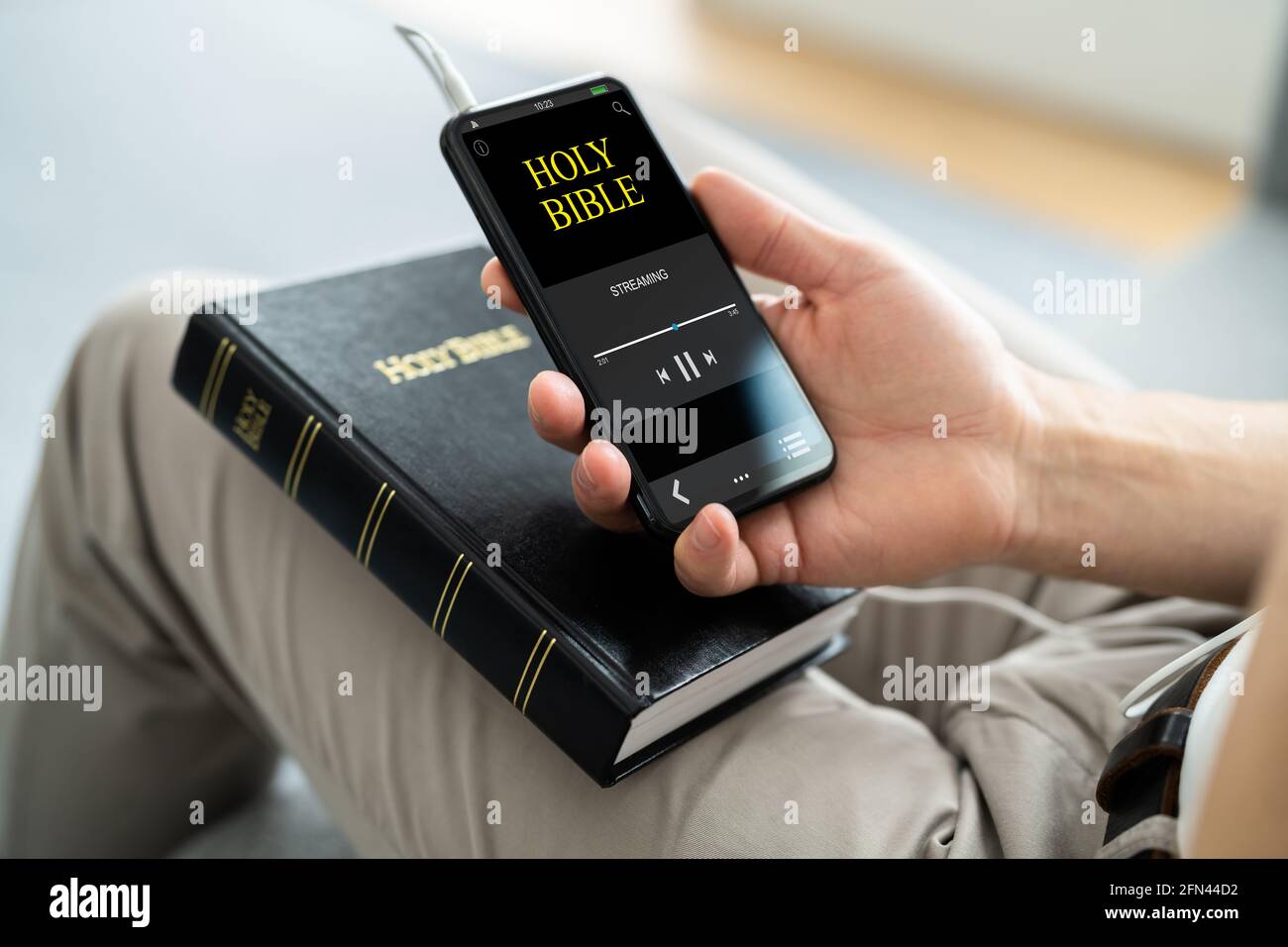 Preacher Listening Bible On Phone. Praying With Headphones Stock Photo ...