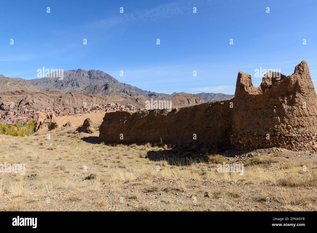 Ruins of an ancient Sasanid fort with the traditional red colored ...