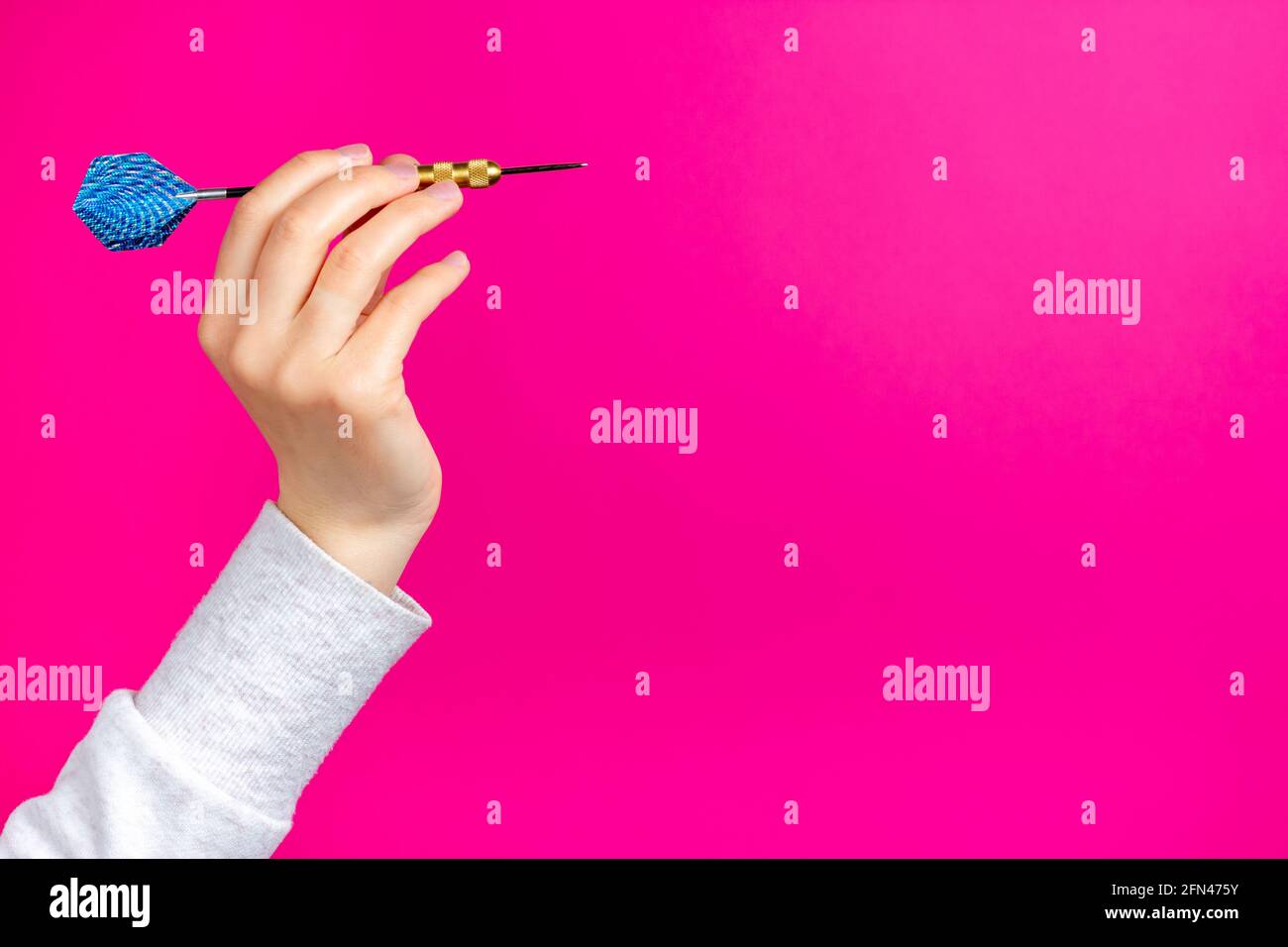 Dart dart in hand. Aiming process. Preparing to throw a dart Stock ...