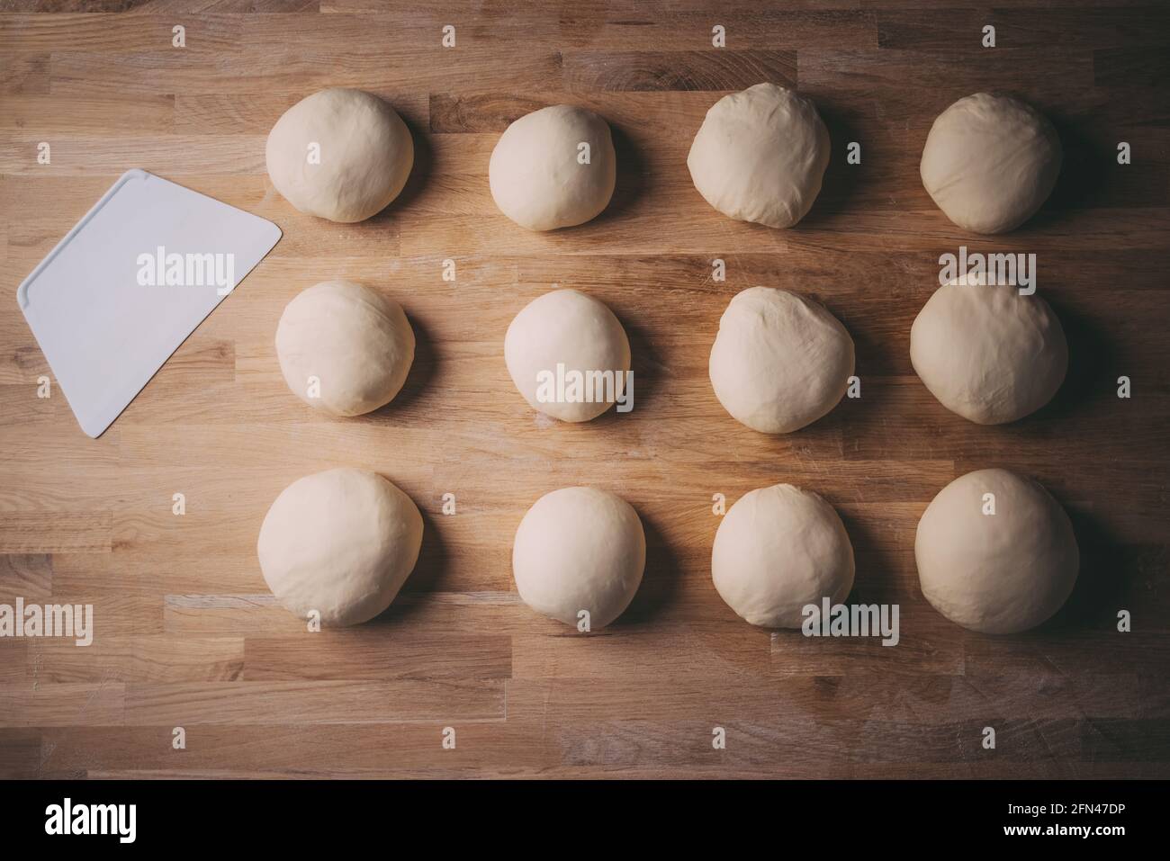 Bread buns in a top view, soft dough in bakery Stock Photo - Alamy