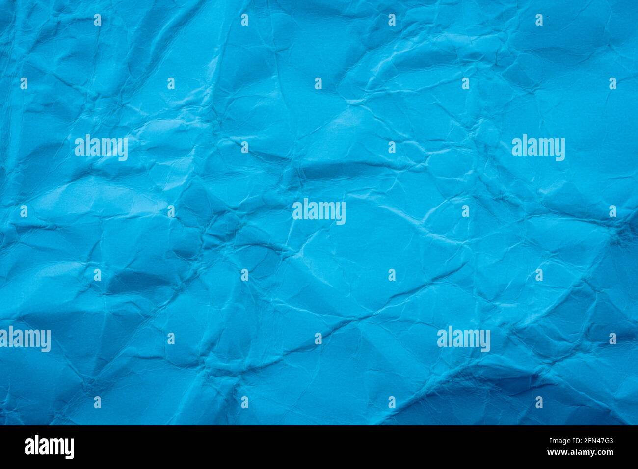 Blue crumpled paper background Stock Photo - Alamy