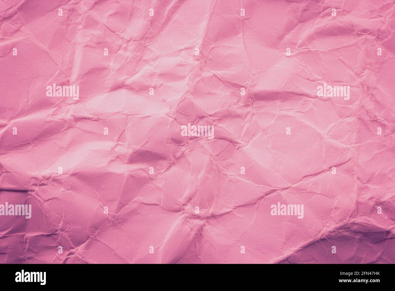 Pink crumpled paper background Stock Photo - Alamy