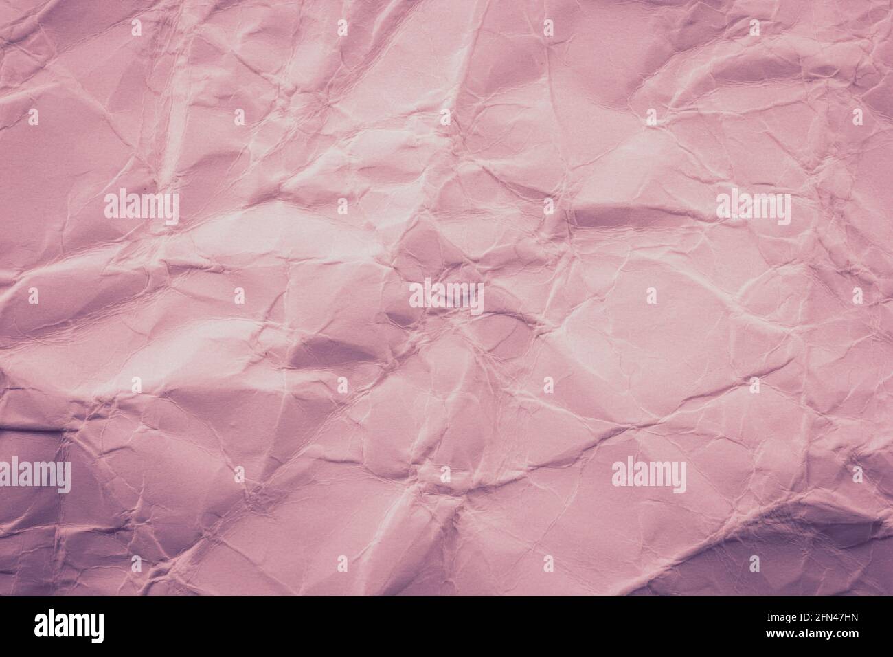 Pink crumpled paper background Stock Photo - Alamy