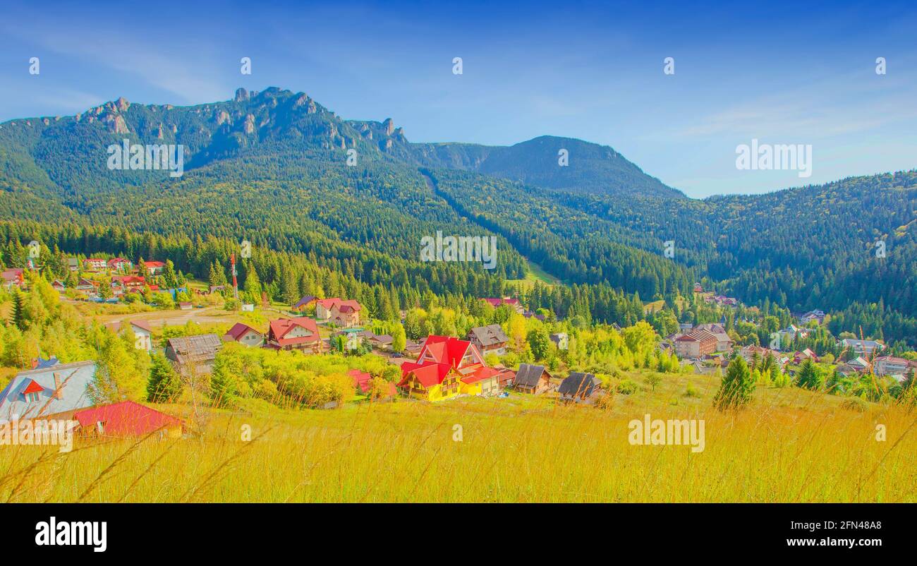 Durau mountain resort in Romanian Carpathians. Ceahlau peak in ...