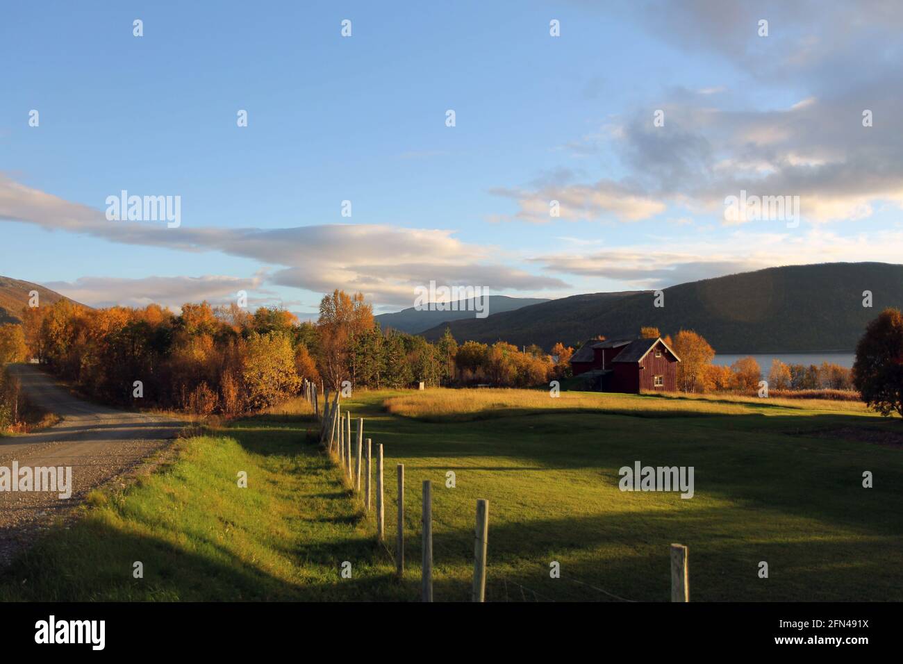 Sunset over a Norwegian fjord. Landscape with Norwegian alps and little ...