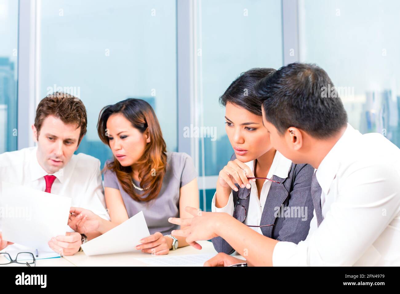 Discussing strategy hi-res stock photography and images - Alamy