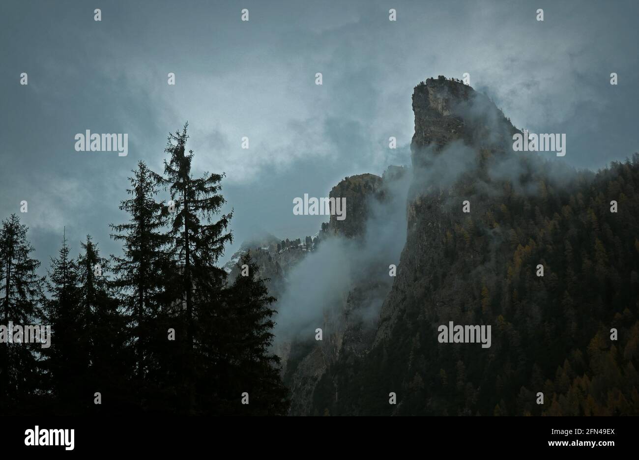 Majestic view of high mountains covered by clouds. Northern lands under ...