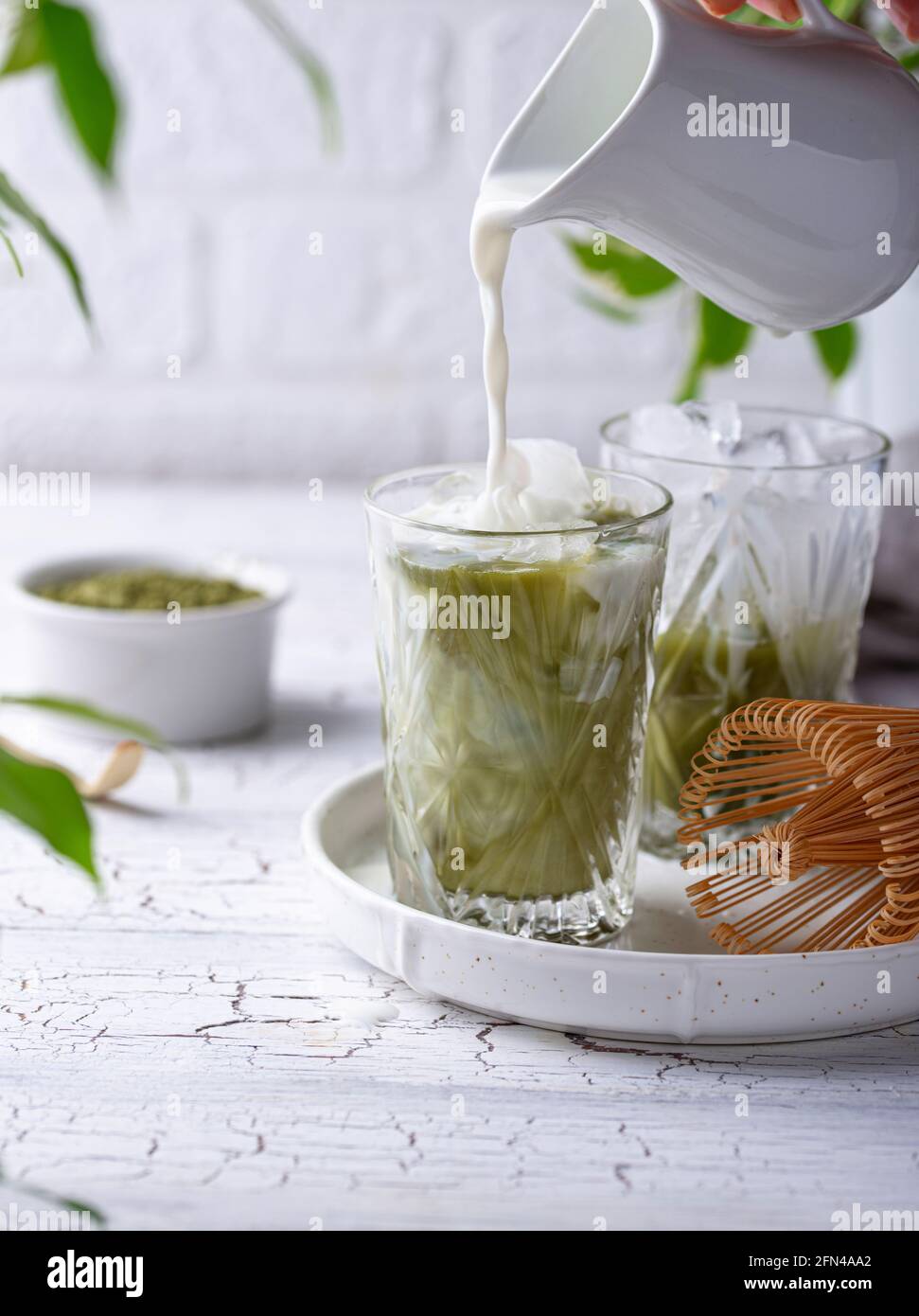 Cold matcha tea with milk and ice Stock Photo - Alamy